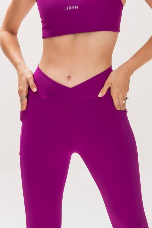 Legging cós alto cruzado de alta compressão e dois bolsos laterais ...